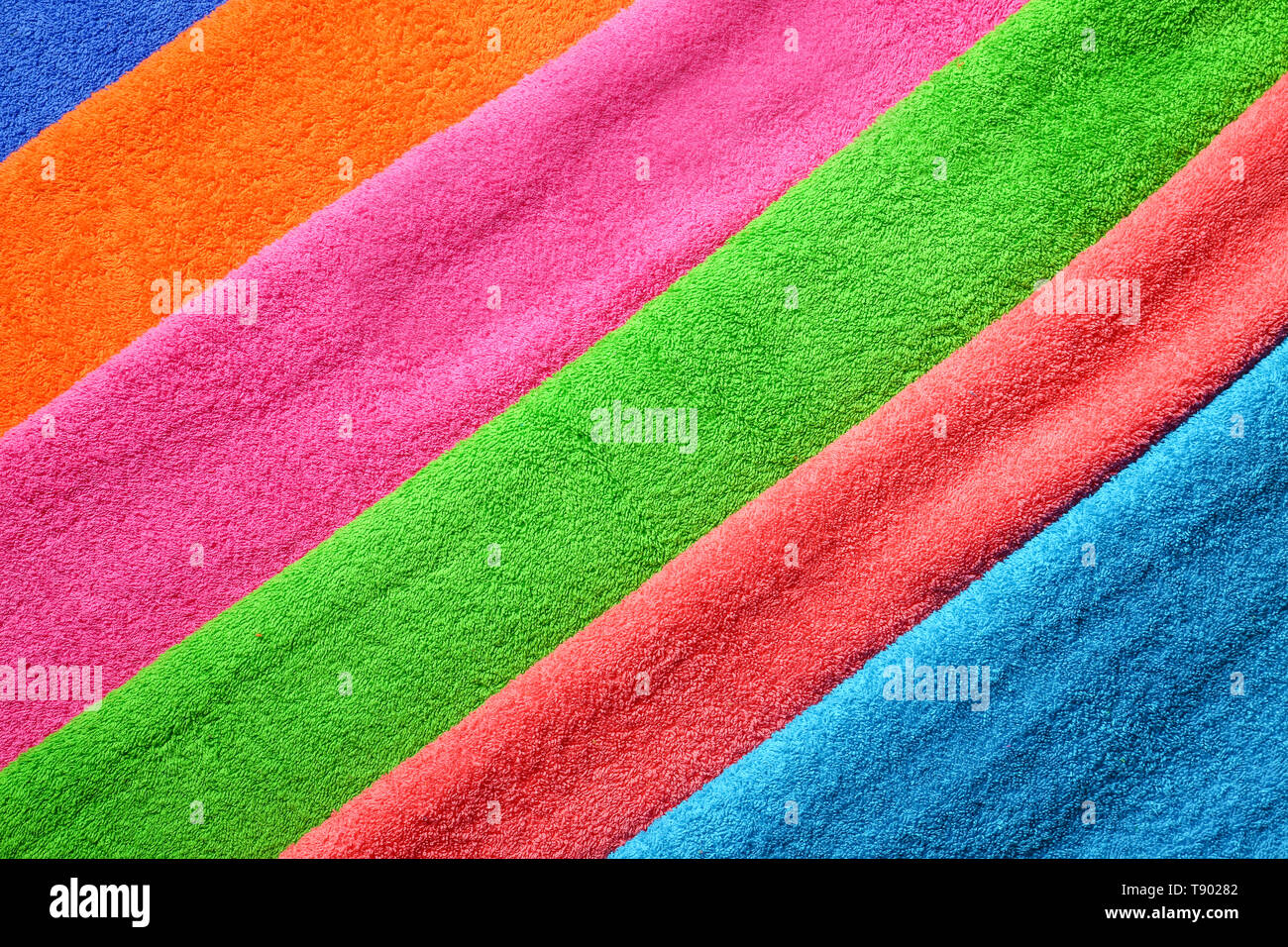 Color terry towels as background, closeup Stock Photo - Alamy