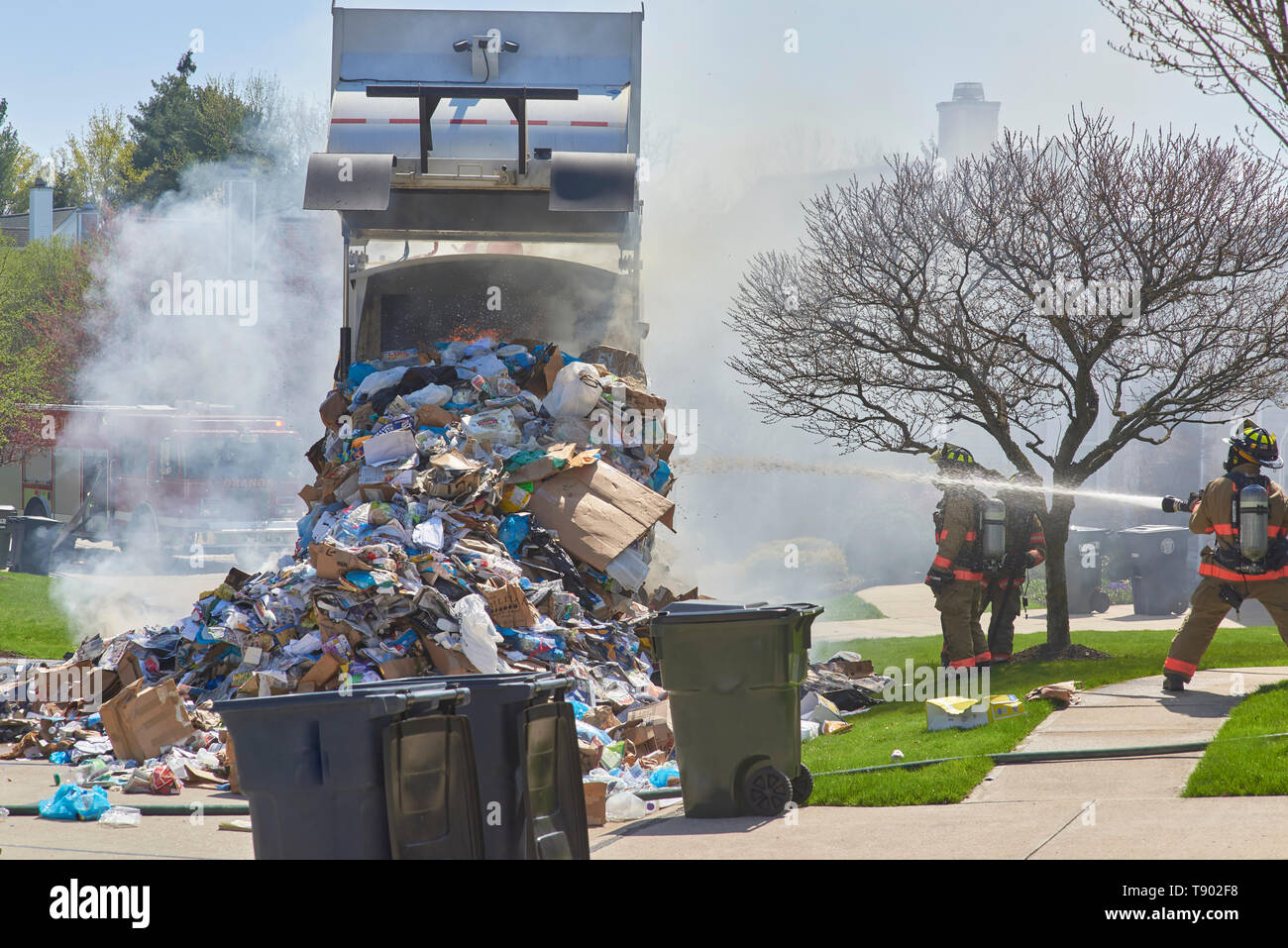 Garbage Truck fire in condominium complex during rubbish pickup Stock ...