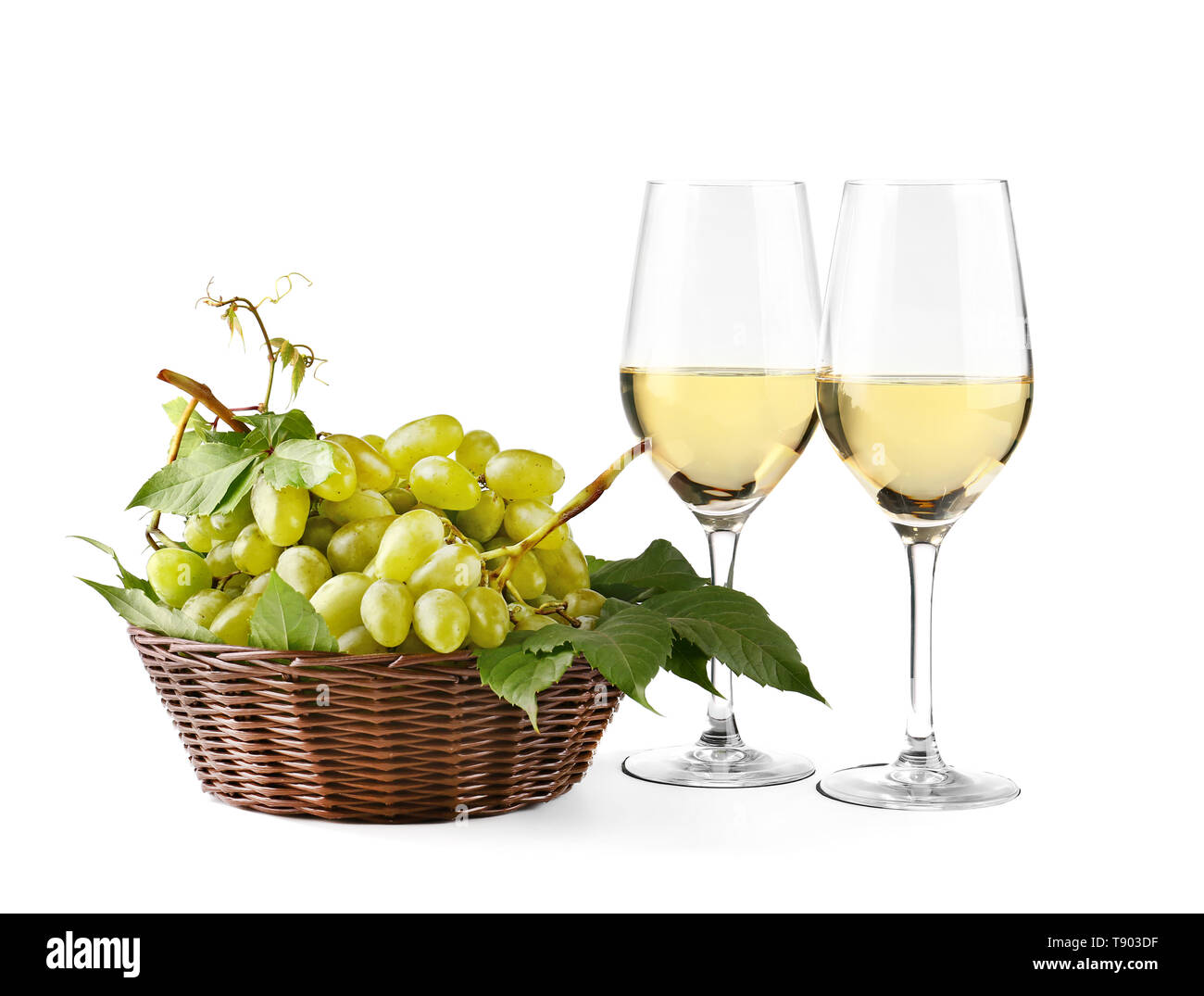 Composition with tasty wine and fresh grapes on white background Stock ...