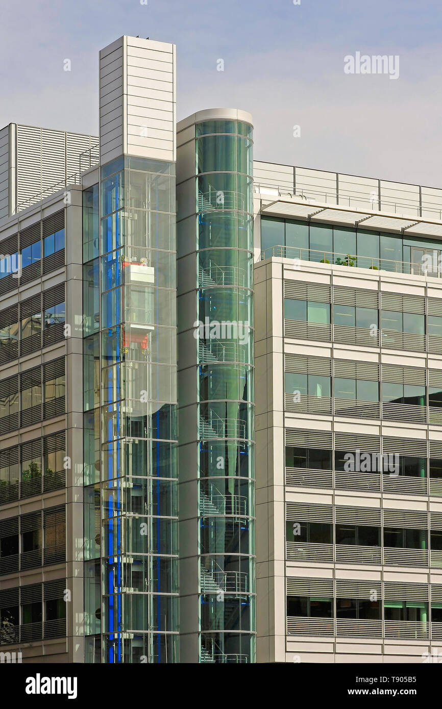 Glass Lift Shaft at Office Building Corner Stock Photo - Alamy