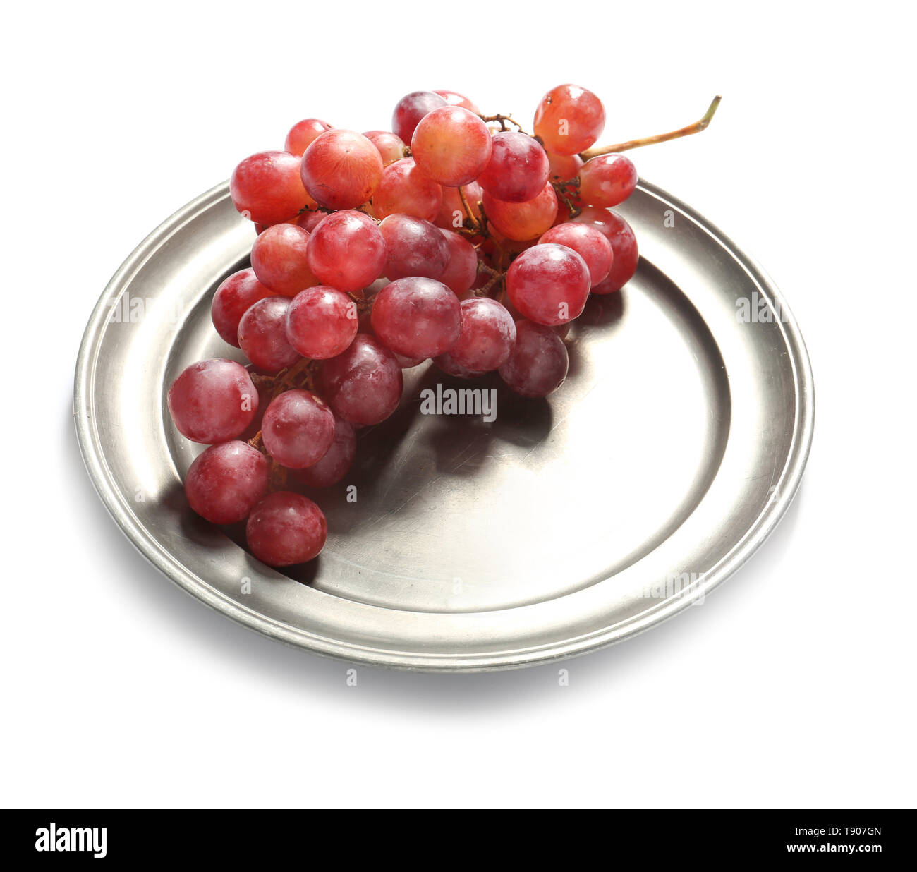 Metal tray with red juicy grapes on white background Stock Photo - Alamy