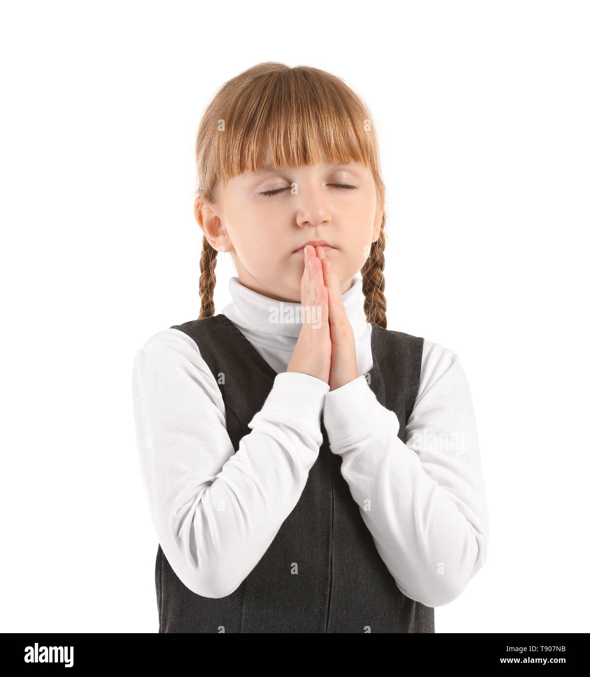 Little girl praying on white background Stock Photo - Alamy