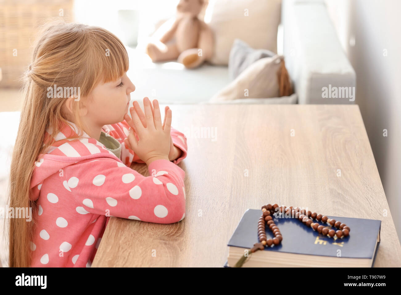 Little girl praying at home Stock Photo - Alamy