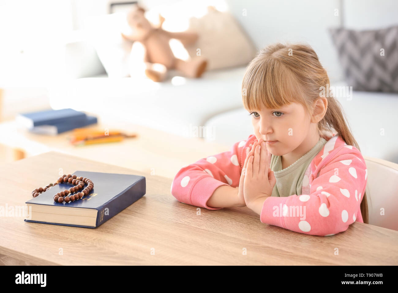Little girl praying at home Stock Photo - Alamy