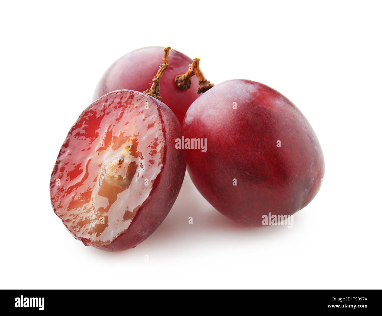 Cut and whole ripe juicy grapes on white background Stock Photo - Alamy