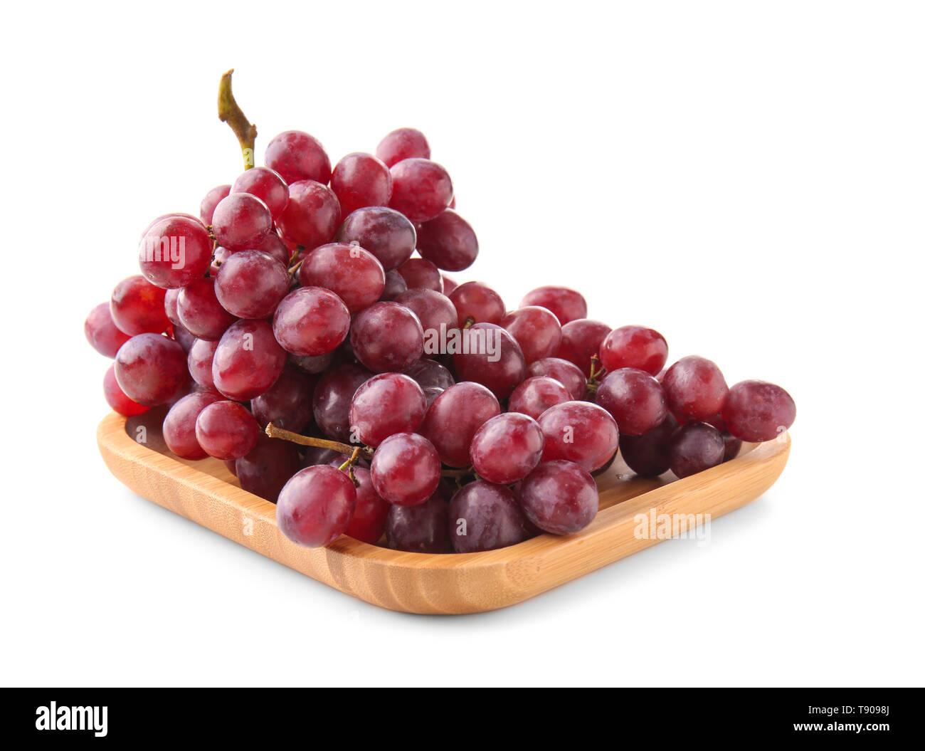 Wooden tray with fresh grapes on white background Stock Photo - Alamy