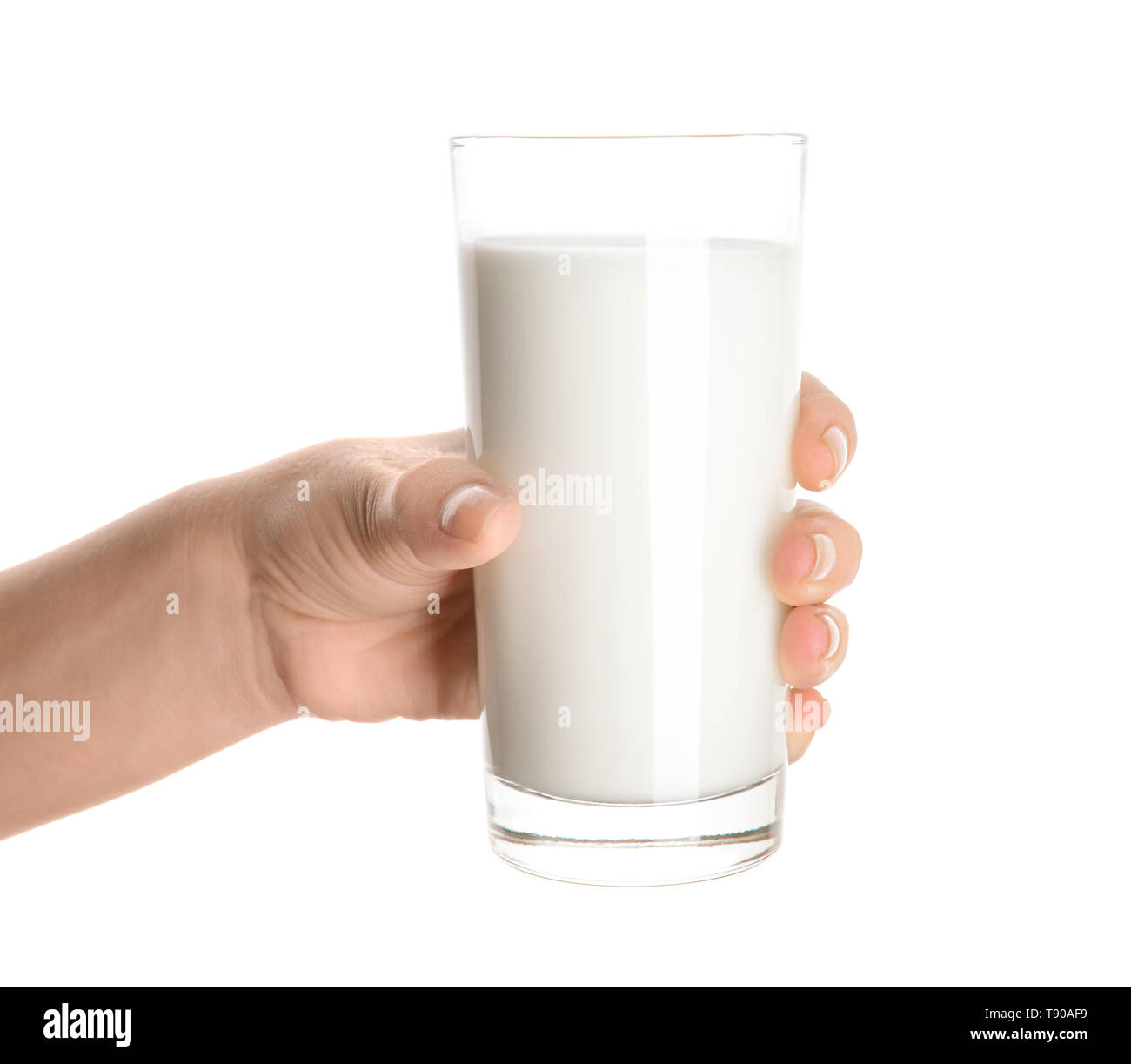 Female hand holding glass of tasty milk on white background Stock Photo ...