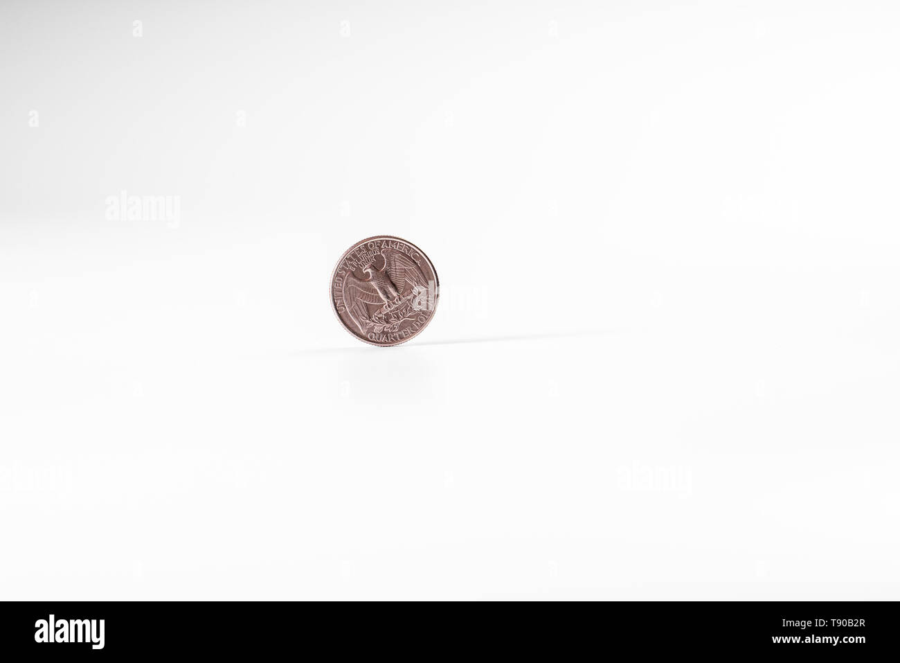 Dollar coin rotating on white background, concept of American economy ...