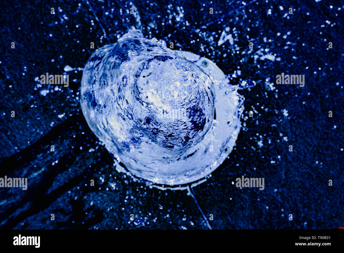 Water jet going up towards the camera, blue tones, background for ...