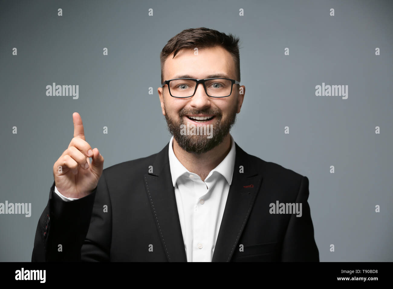 Businessman man raised index finger hi-res stock photography and images ...