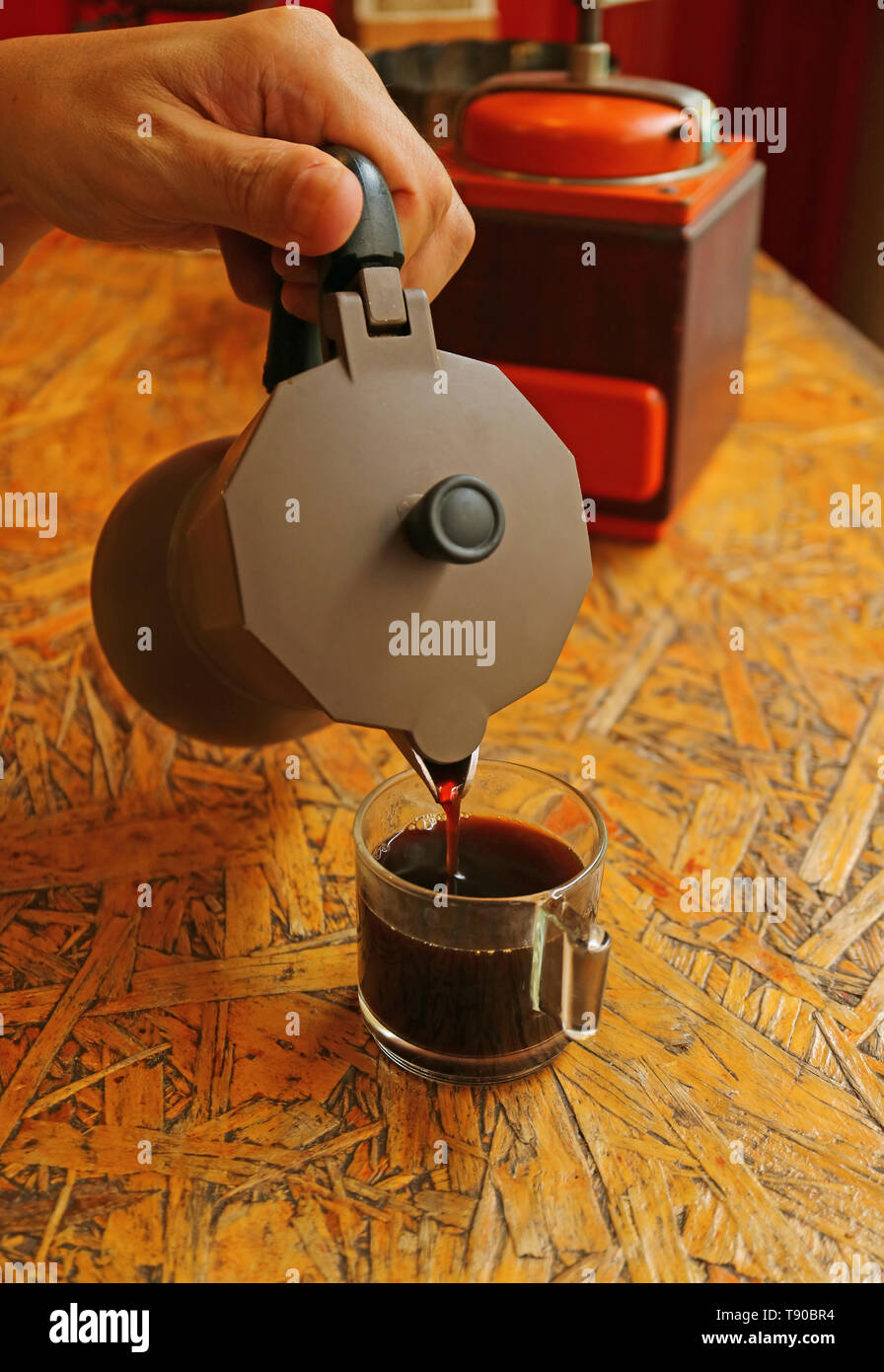 Mans hand pouring aromatic hi-res stock photography and images - Alamy