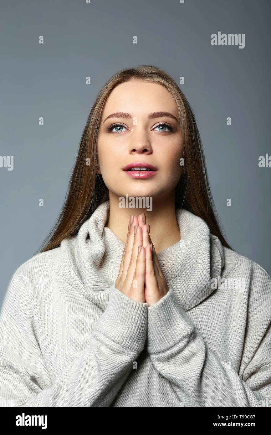 Woman praying hi-res stock photography and images - Alamy