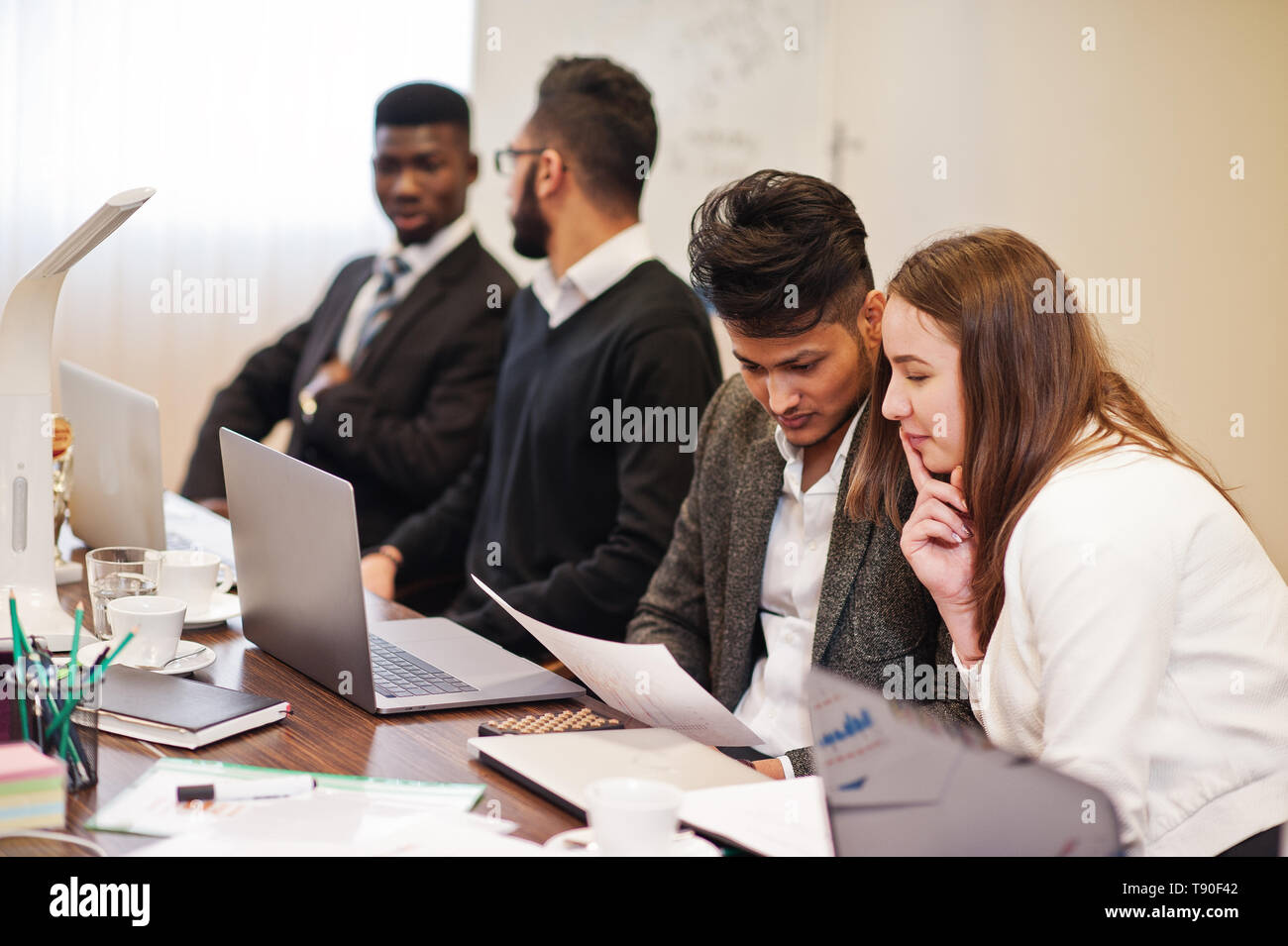 Woman addressing group of men hi-res stock photography and images - Alamy