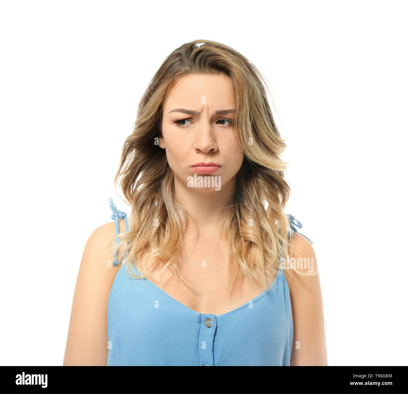 Portrait of offended young woman on white background Stock Photo - Alamy