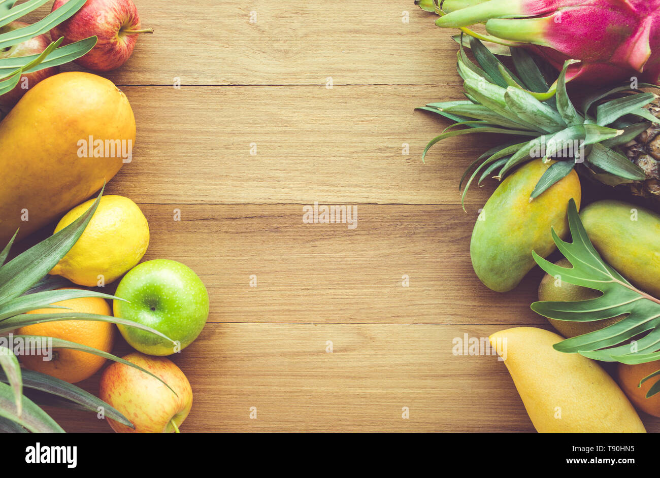 Group of fruits on wood table with space background Stock Photo - Alamy