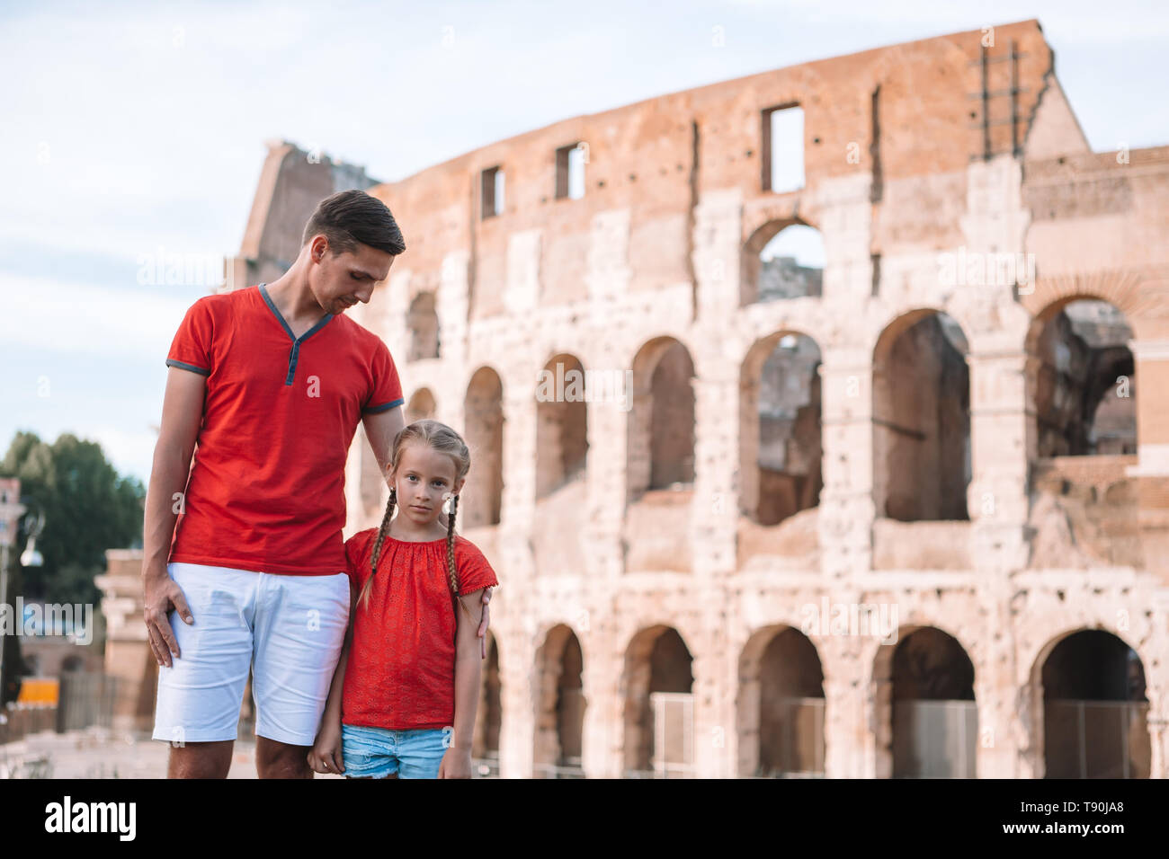 Happy family in Rome over Coliseum background Stock Photo - Alamy