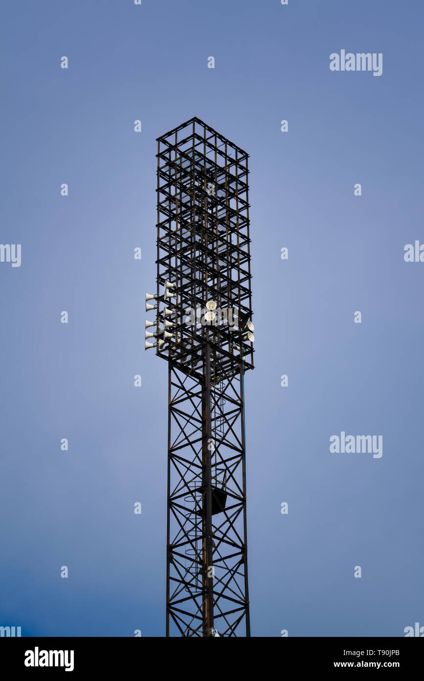 Lighting tower of the stadium against the blue sky Stock Photo - Alamy