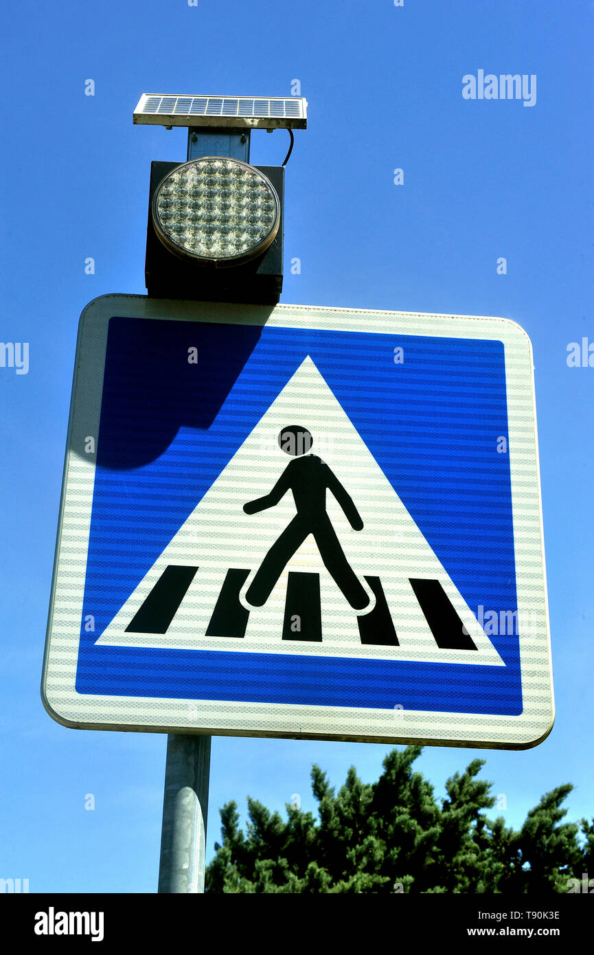 sign indicating a protected crossing on the road for pedestrians Stock ...