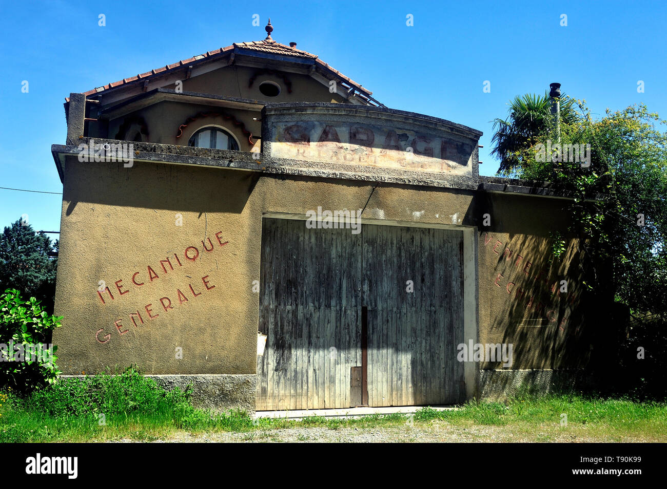 front of an old mechanical garage abandoned in rural areas Stock Photo ...