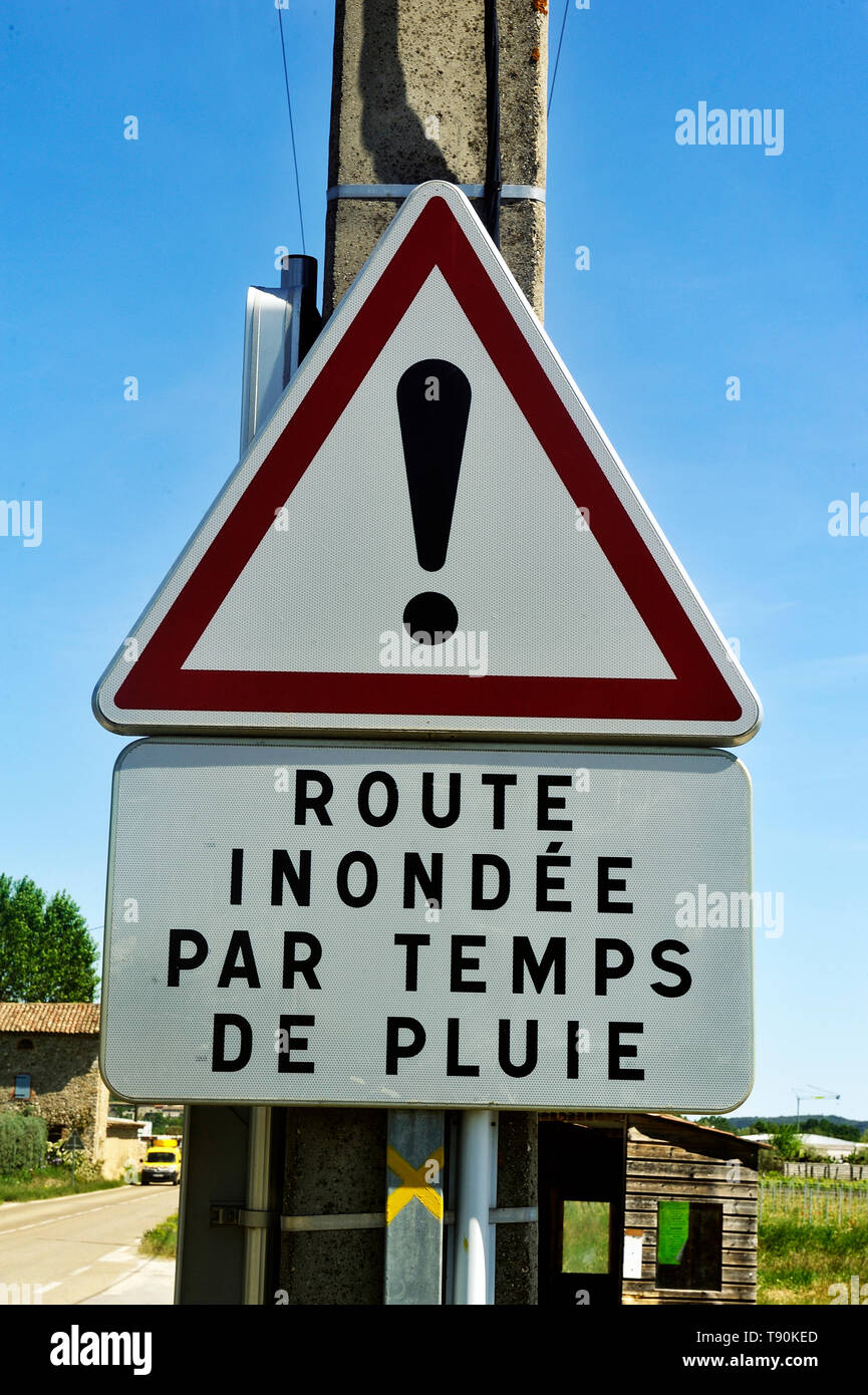 road sign indicating flood hazard in rainy weather Stock Photo - Alamy