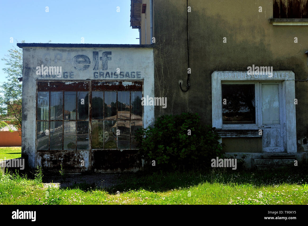 front of an old mechanical garage abandoned in rural areas Stock Photo ...