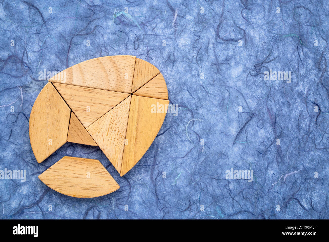 egg version of tangram, ancient Chinese puzzle - wooden pieces on a ...