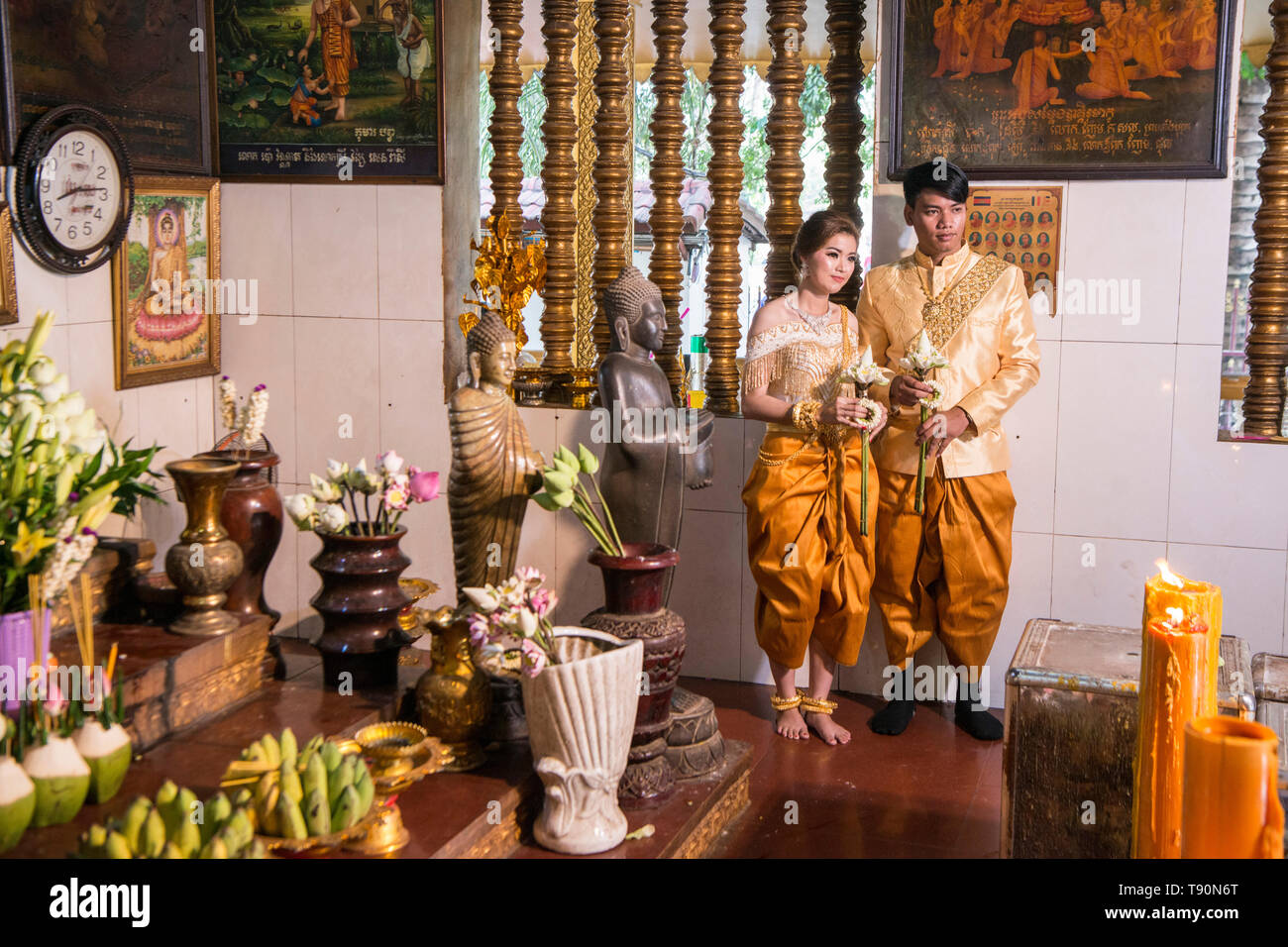 a khmer wedding ceremony at the Preah Angchek or Preah Ang Chorm Shrine ...