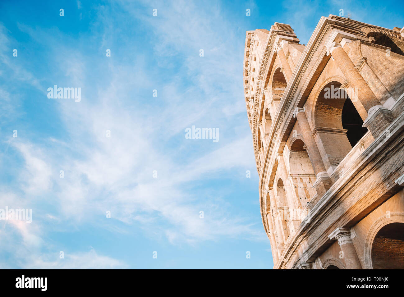 Colosseum or Coliseum background blue sky in Rome Stock Photo - Alamy