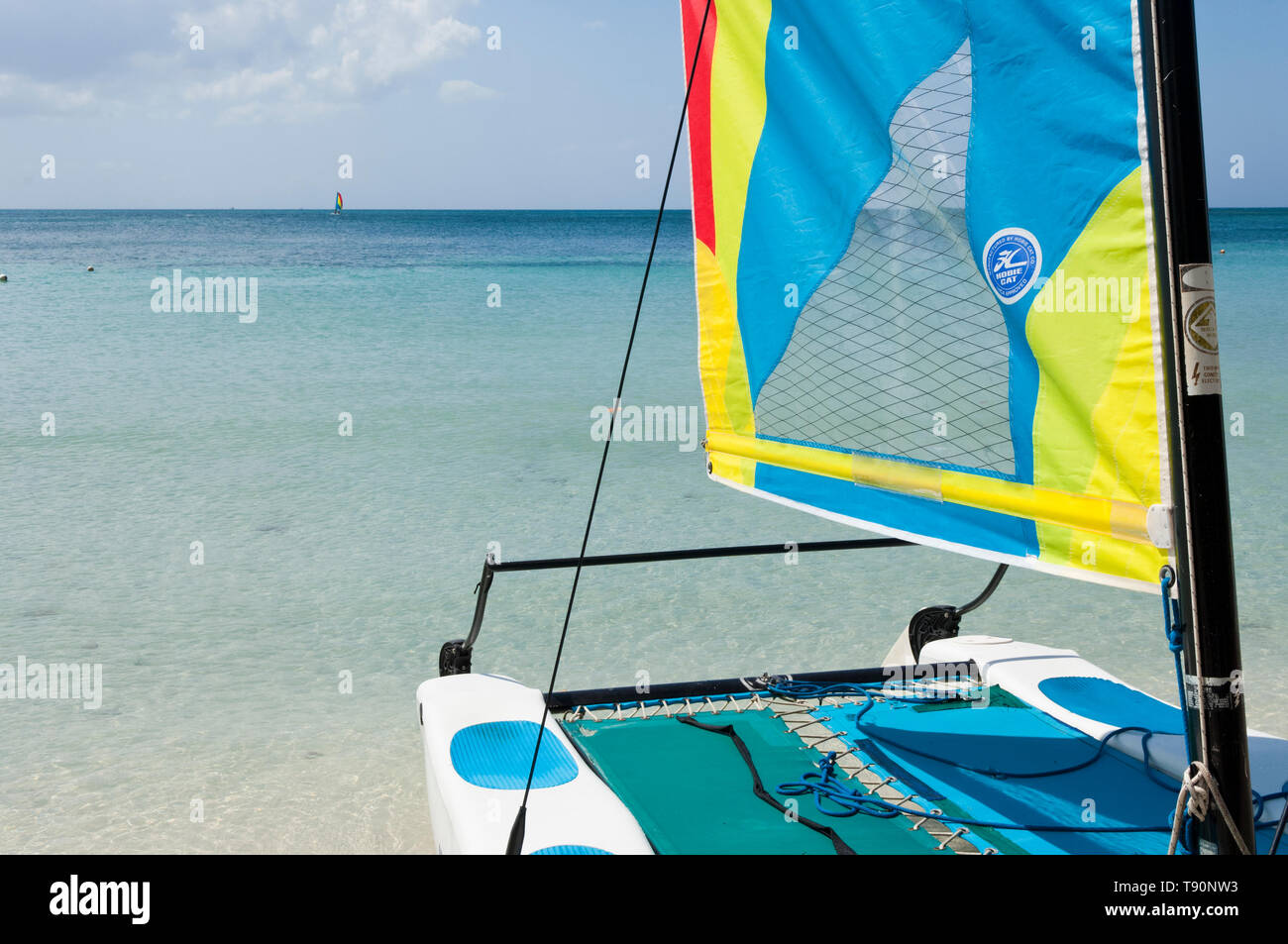 Small sailing catamaran on the shores of Bloody Bay, Negril, Jamaica ...