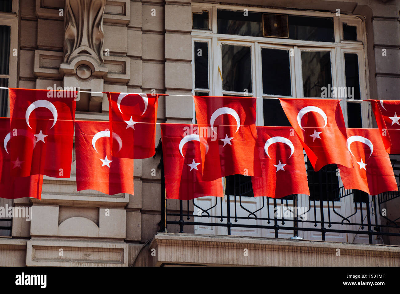 Turkish national flags with white star and moon in sky Stock Photo - Alamy