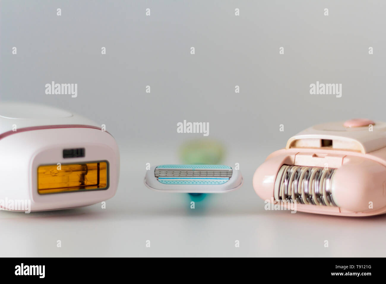 Razor, epilator and IPL epilator on white background. Hair removal ...