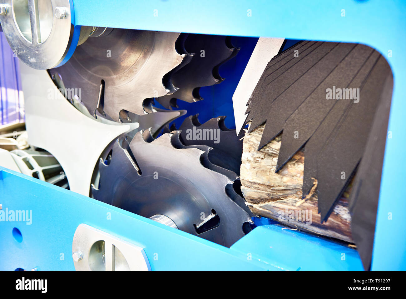 Log sawing machine in factory Stock Photo - Alamy