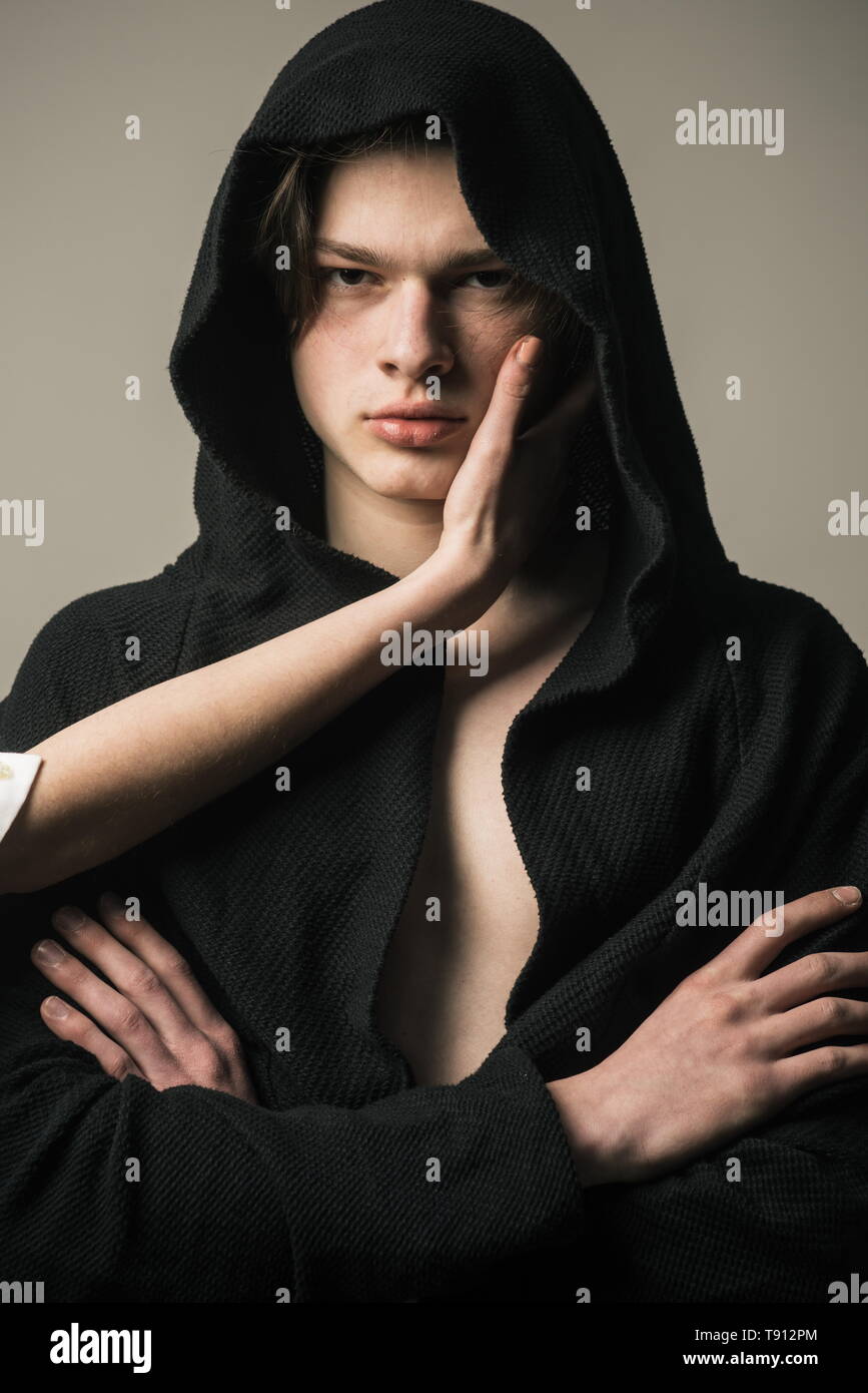 Skin concept. Man with young healthy skin. Hand touch face skin of ...