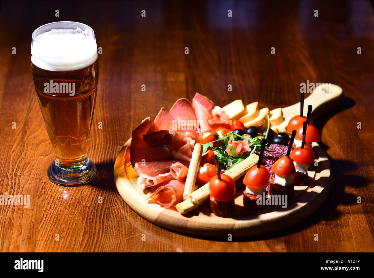 Glass of beer and snacks on table. Cold beer drink. Quench your thirst ...
