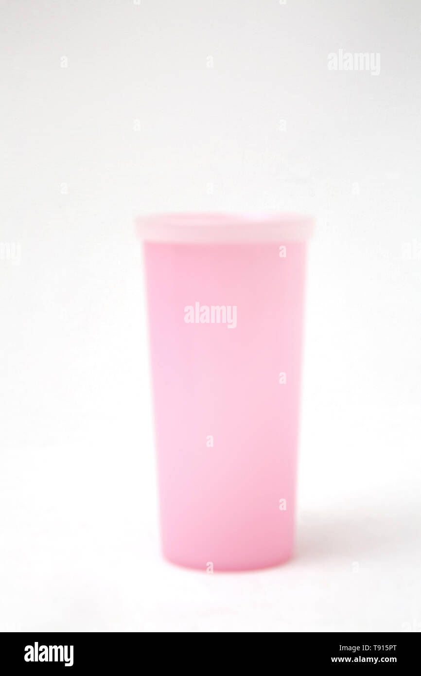 Vintage Pink Tupperware Beaker with Lid Stock Photo - Alamy