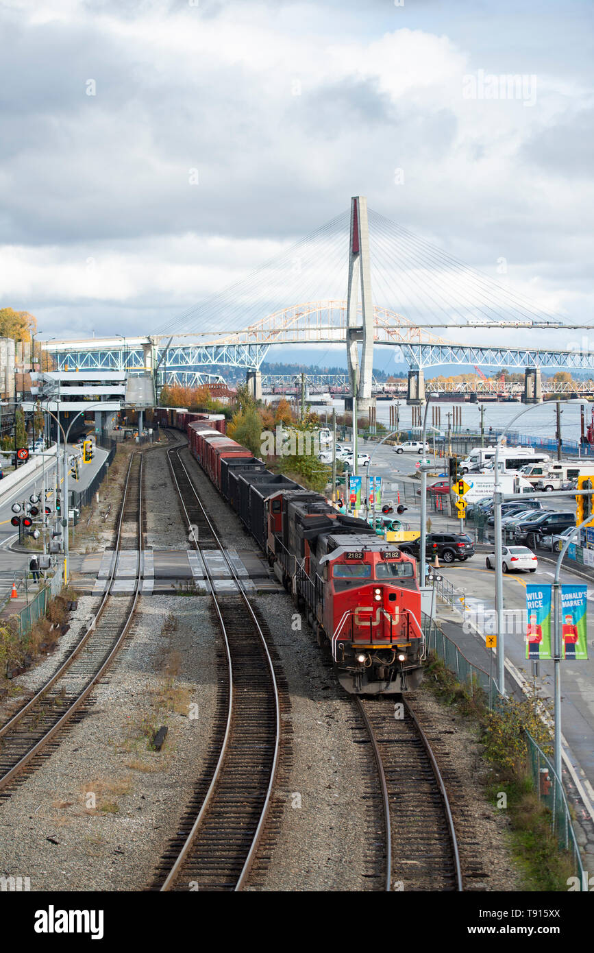 A CN freight train passes through New Westminster, British Columbia ...