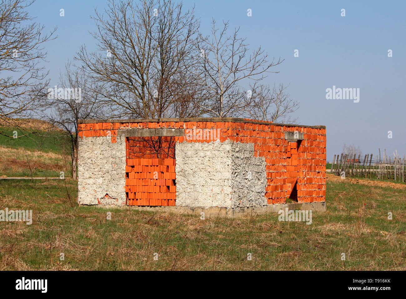 Unfinished red brick outdoor building without roof or windows ...