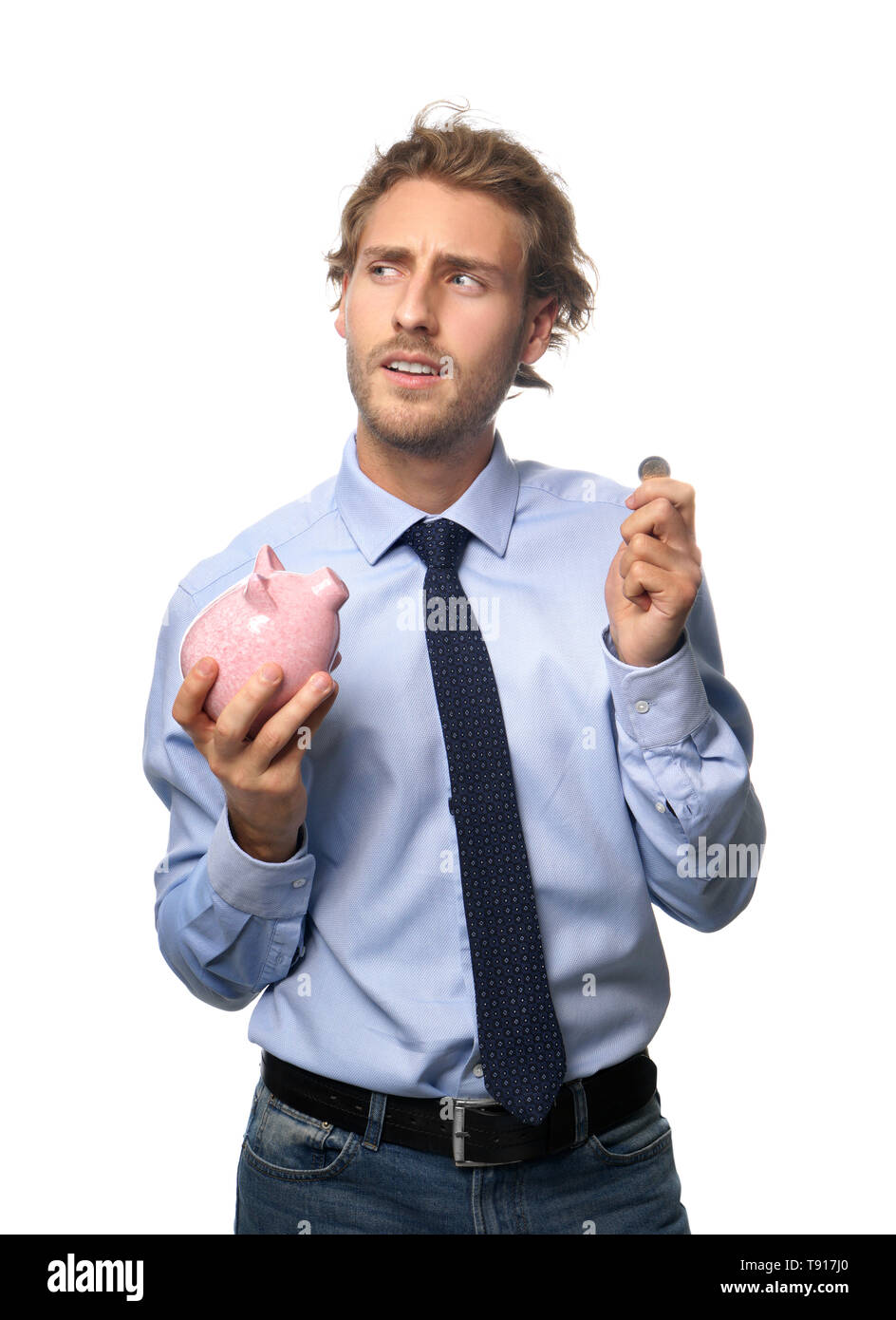 Handsome man with piggy bank on white background Stock Photo - Alamy