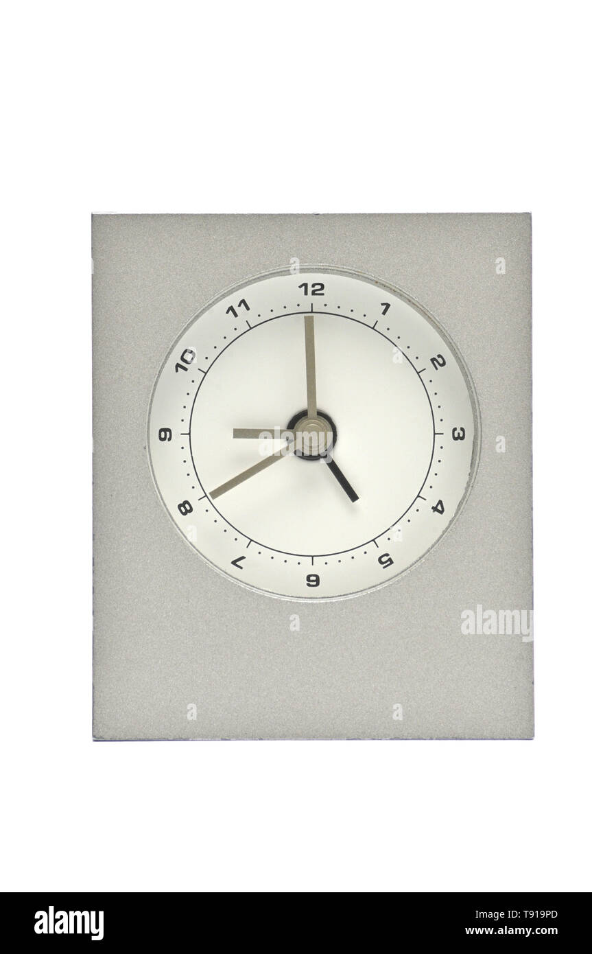 Silver metal clock on an isolated white background.Watch Stock Photo ...