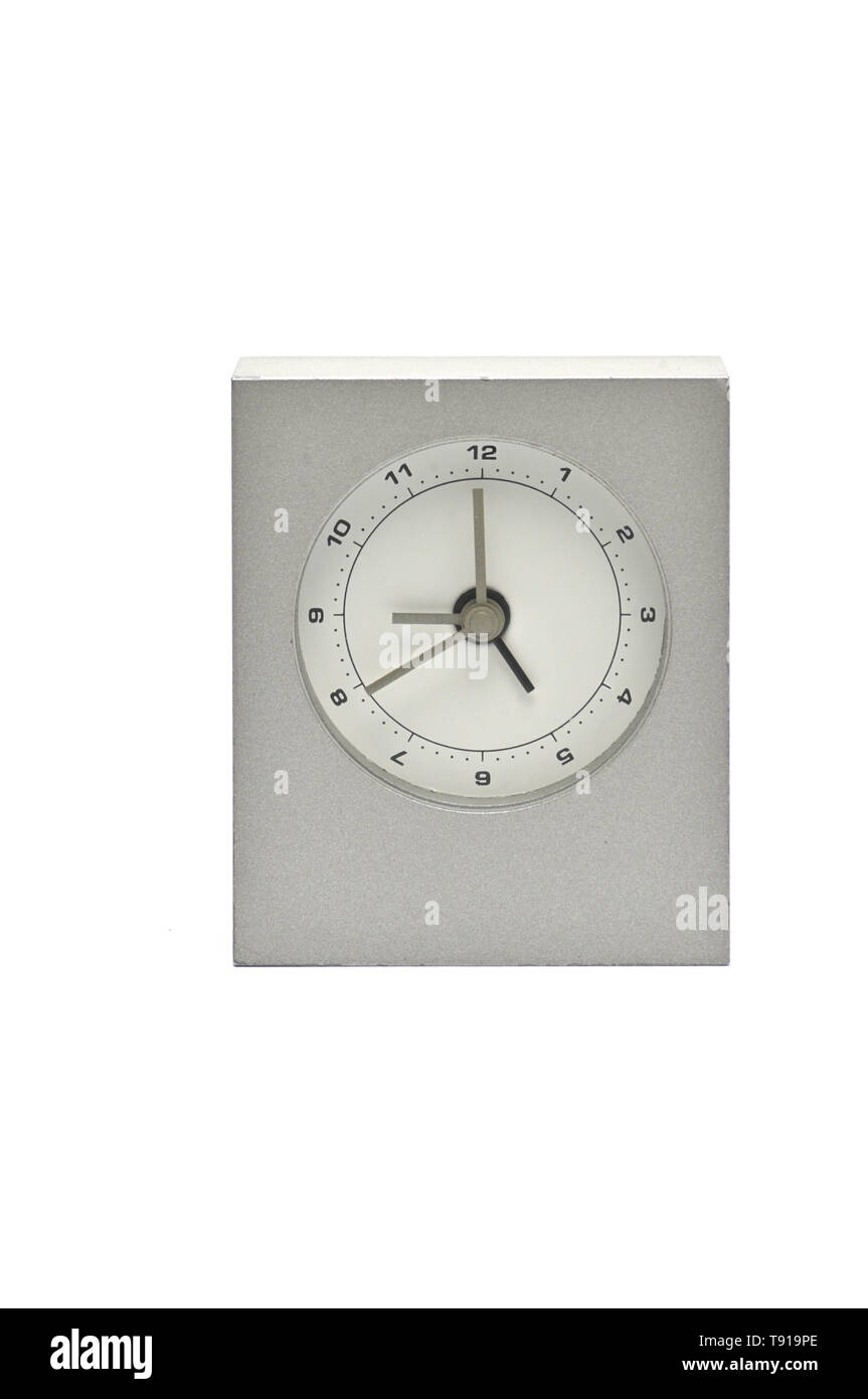 Silver metal clock on an isolated white background.Watch Stock Photo ...
