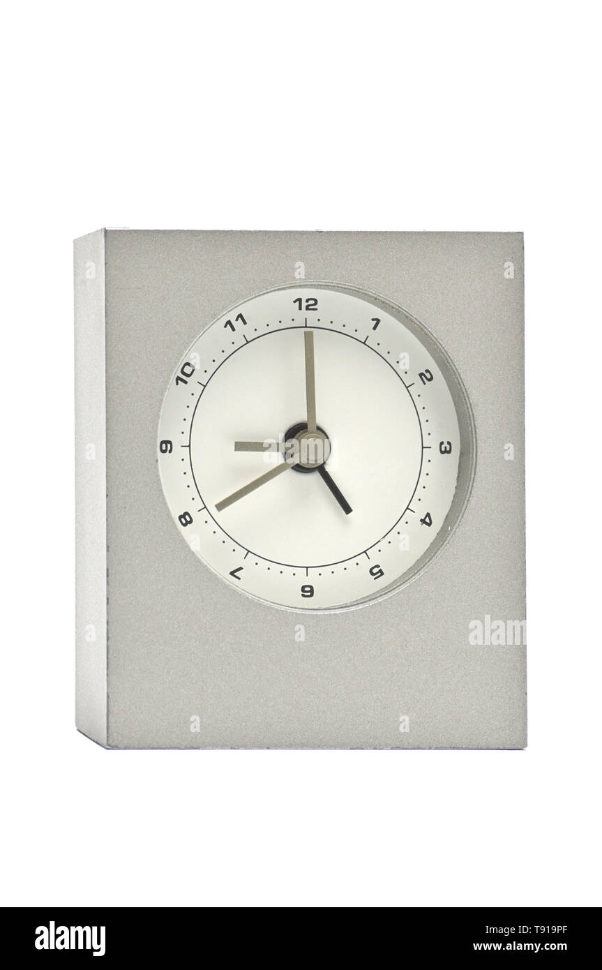 Silver metal clock on an isolated white background.Watch Stock Photo ...