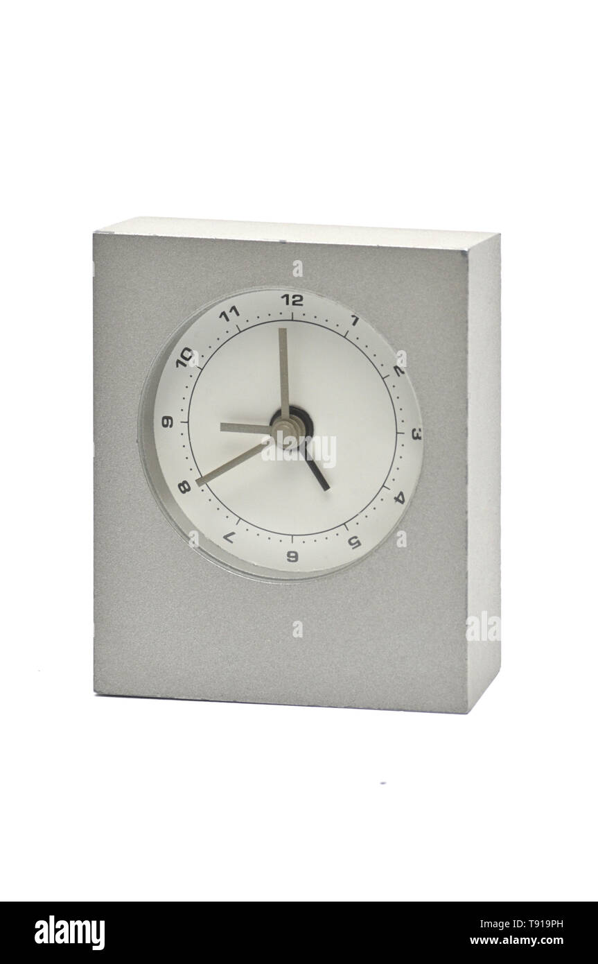 Silver metal clock on an isolated white background.Watch Stock Photo ...