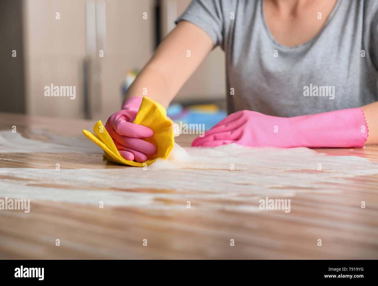 Female janitor cleaning wooden hi-res stock photography and images - Alamy