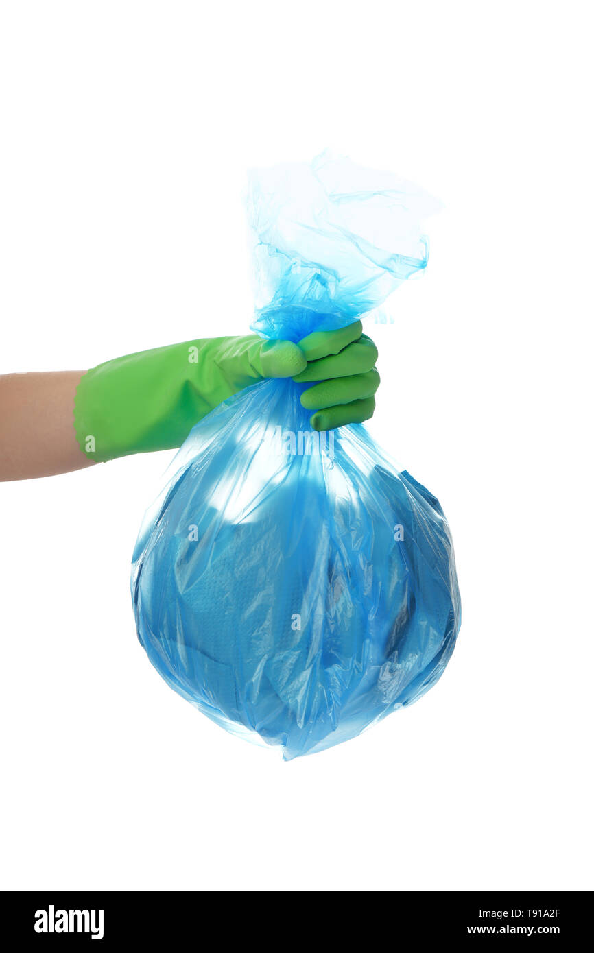 Woman holding garbage bag on white background Stock Photo - Alamy