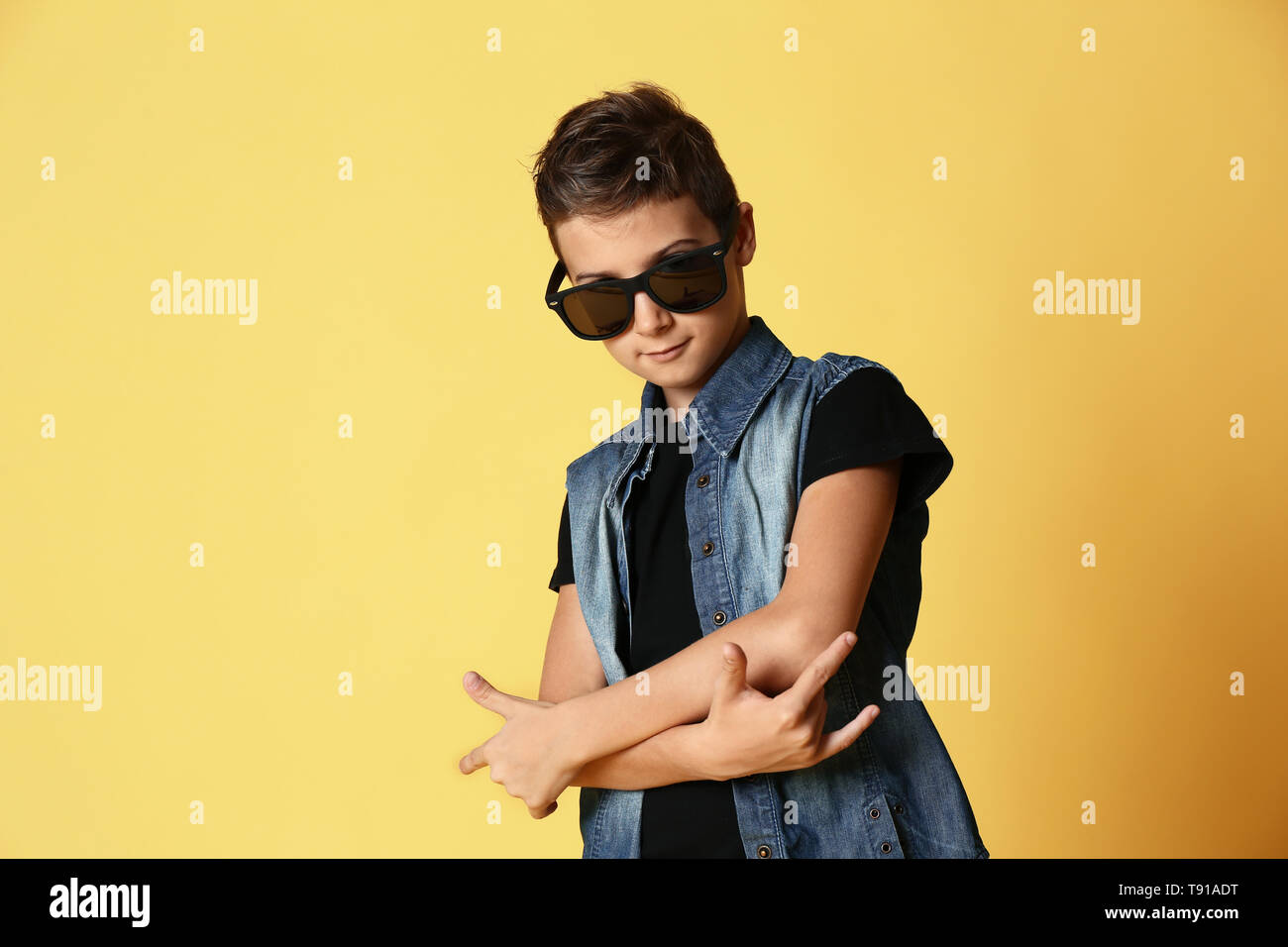 Cute boy in fashionable clothes on color background Stock Photo - Alamy