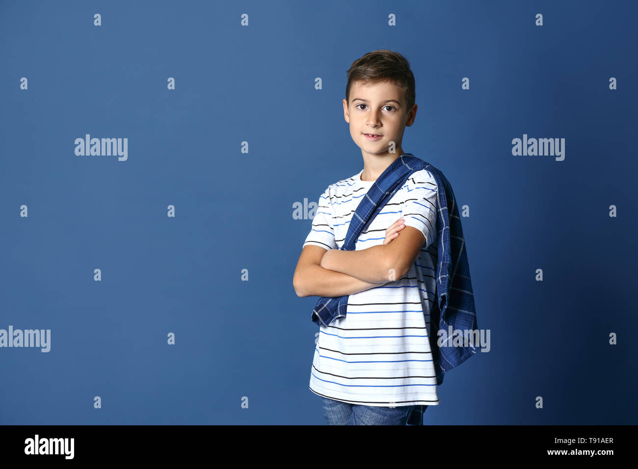 Cute boy in fashionable clothes on color background Stock Photo - Alamy