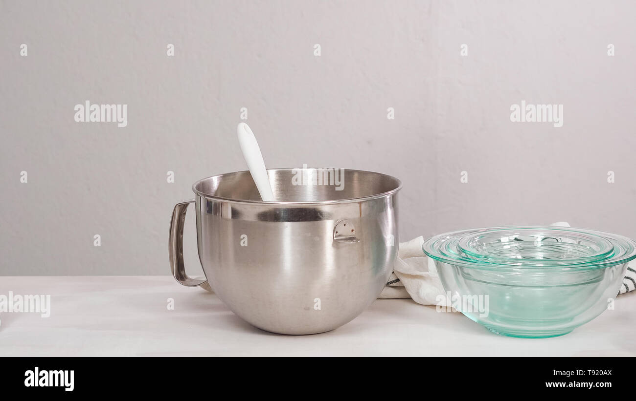 Step by step. Flat lay. Mixing royal icing in electric kitchen mixer ...