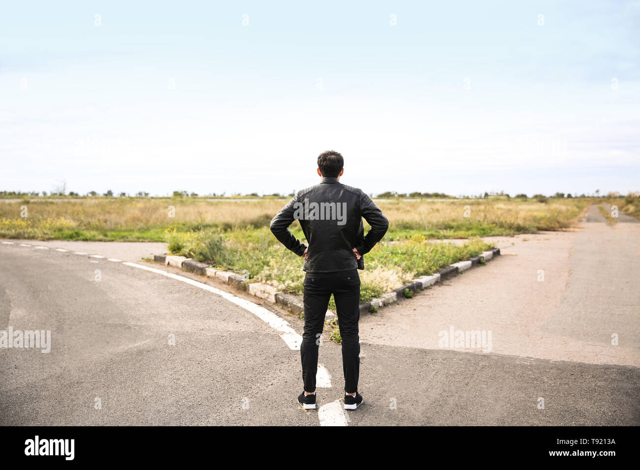 Man standing at crossroads hi-res stock photography and images - Alamy