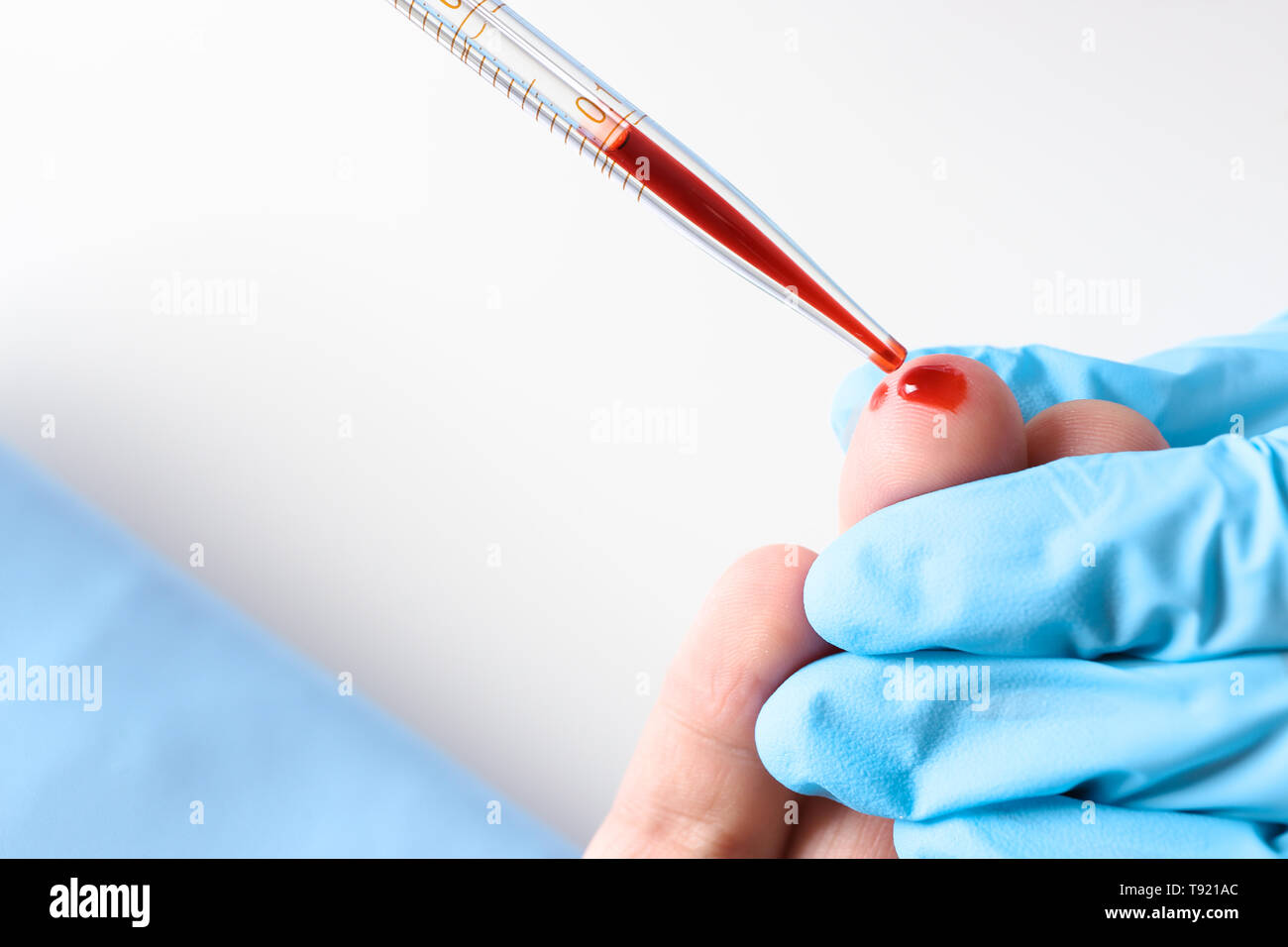 Doctor taking blood sample hi-res stock photography and images - Alamy