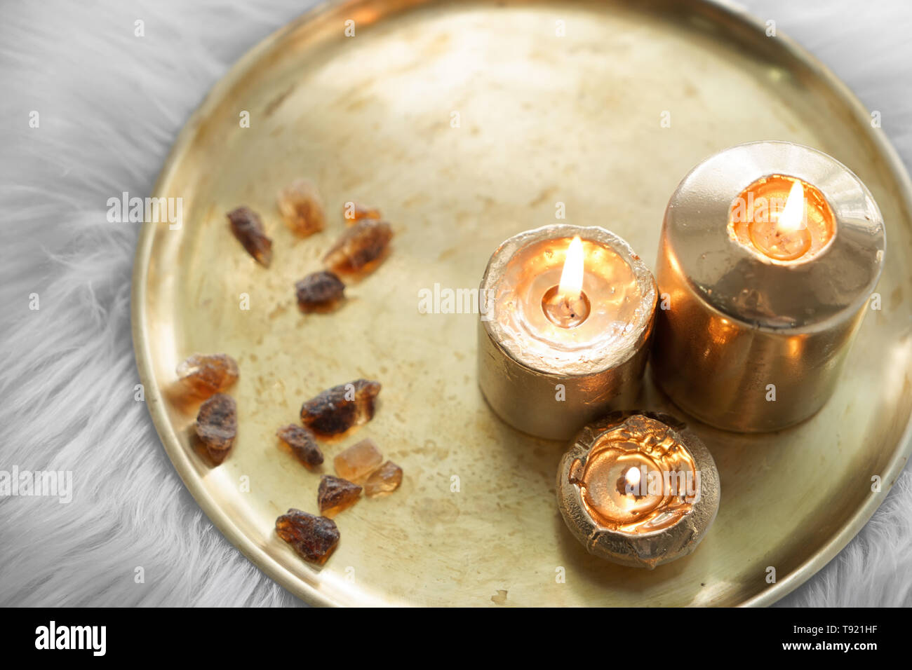 Golden tray burning candles hi-res stock photography and images - Alamy